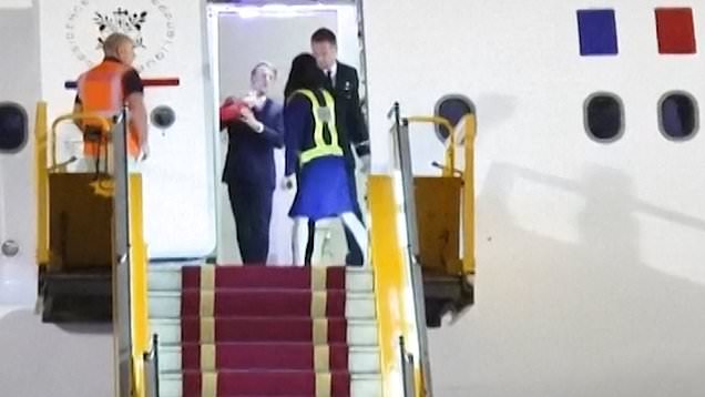 Moment Emmanuel Macron appears to be pushed in the face by his wife