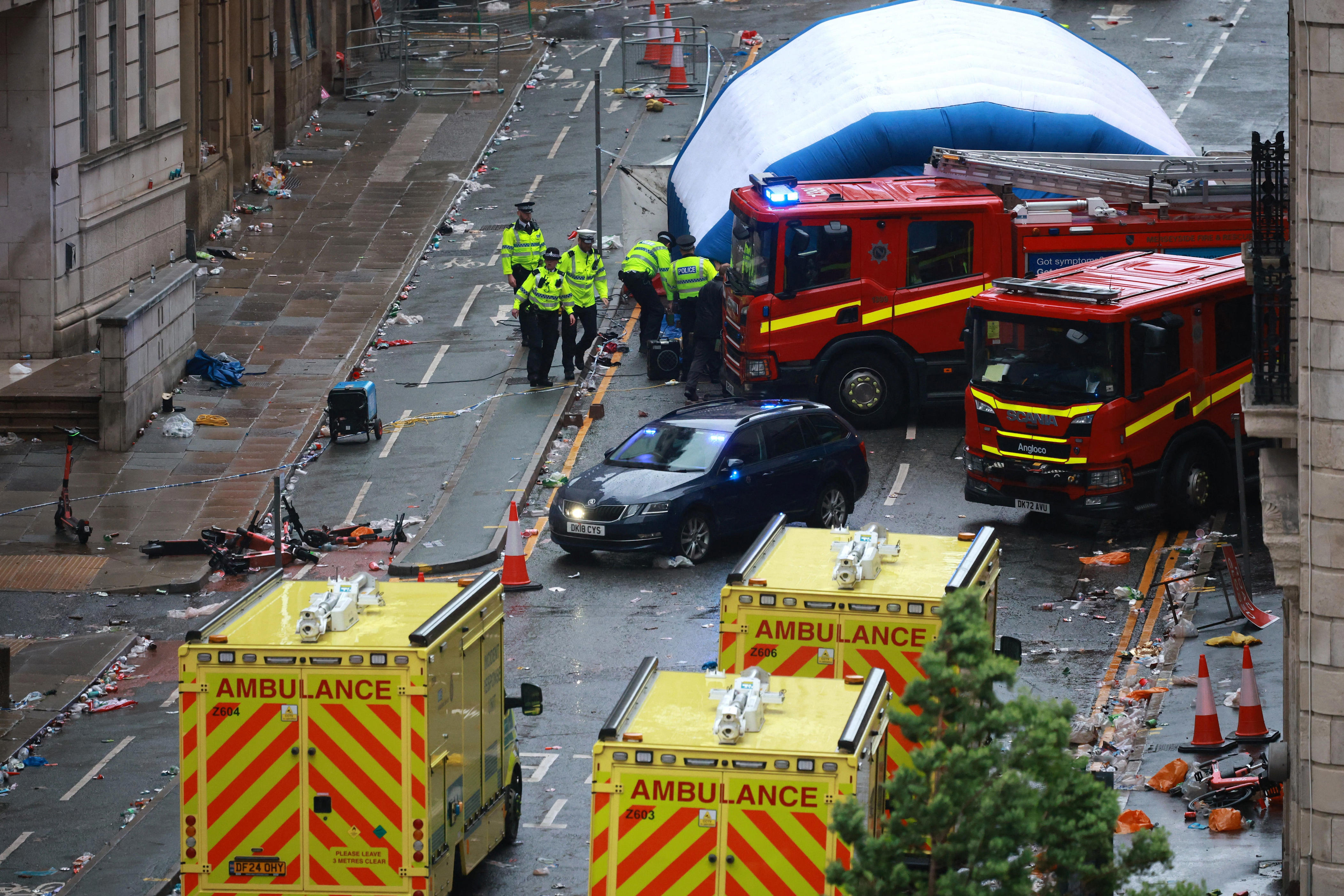 Car driver plows into Liverpool title parade crowd