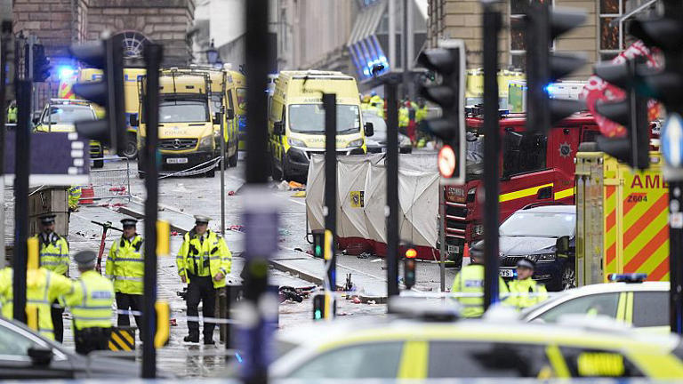 Dozens injured after car ploughs into crowd during Liverpool FC parade