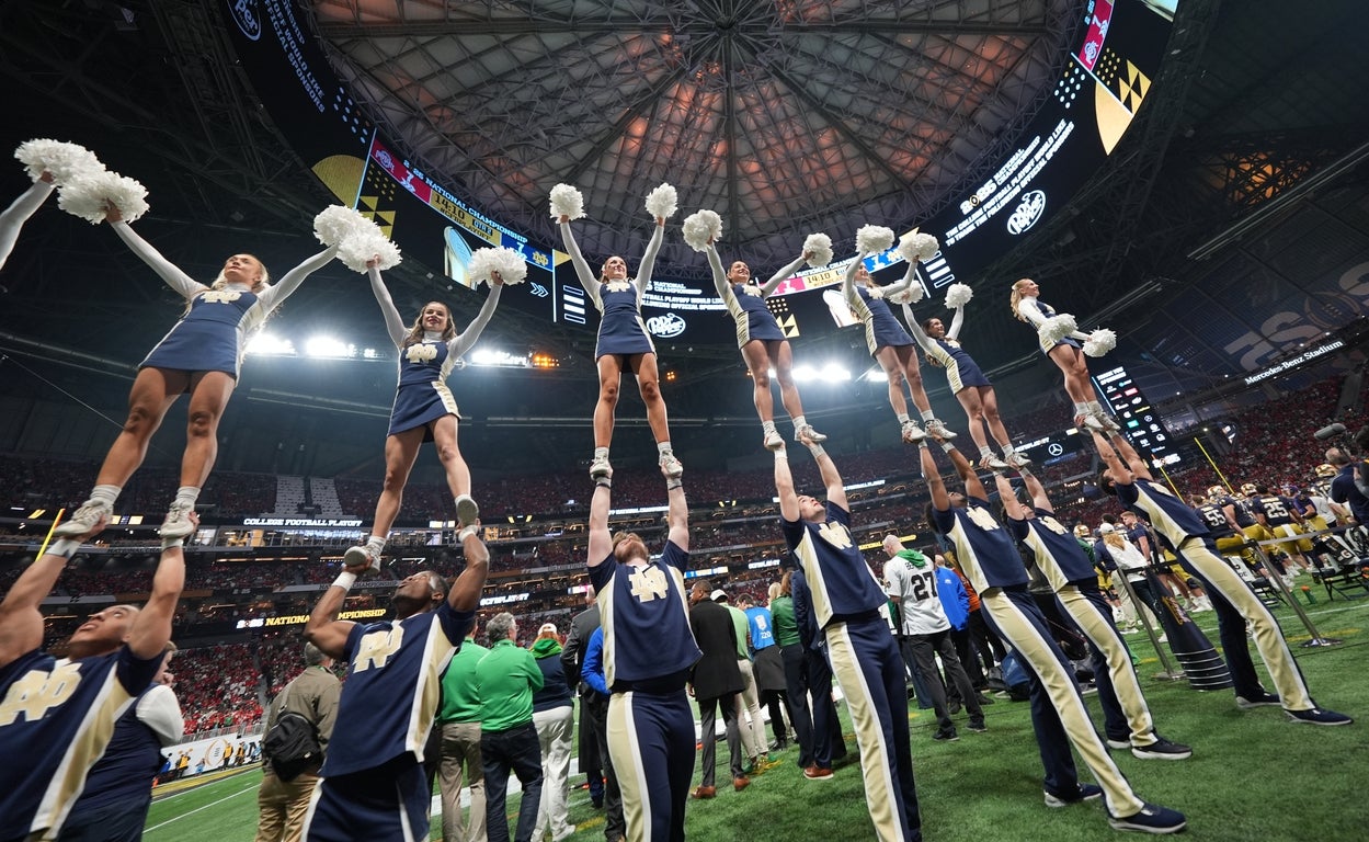 Unforgettable college football cheerleader moments, in photos