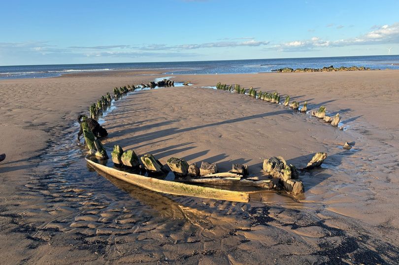 Ship's skeleton exposed: Remains of historic foundered vessel spotted ...