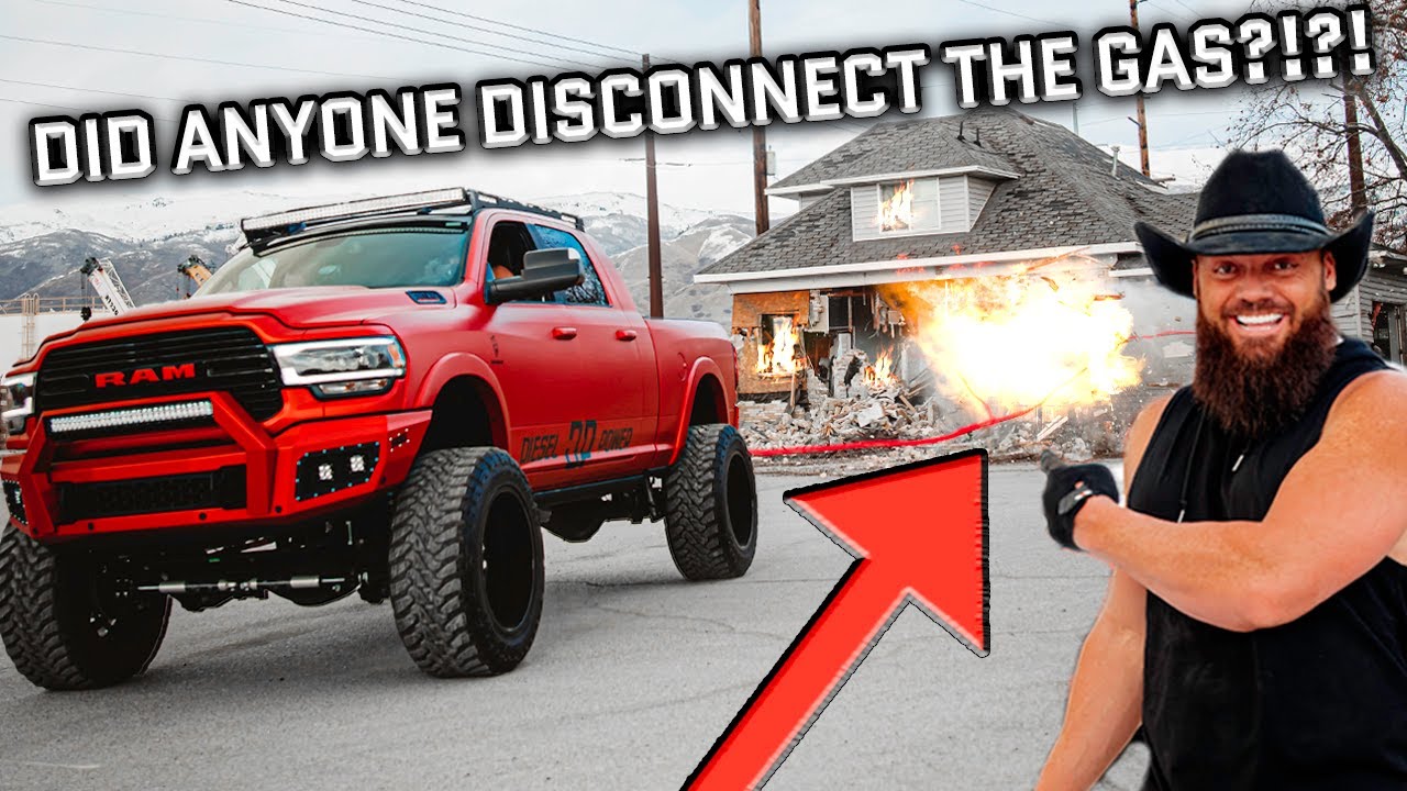 A pickup truck attempts to pull a house off its foundation