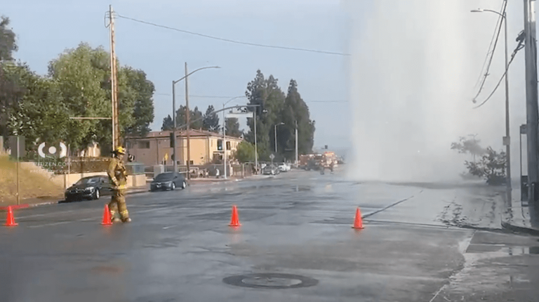 Sheared hydrant soaks high-voltage power lines in San Fernando Valley
