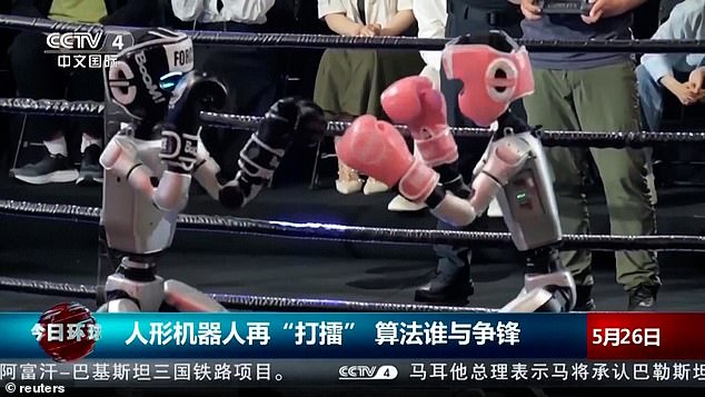Watch as two lifesize robots swing punches at each other in the world's first humanoid boxing match