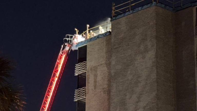 Woman hospitalized after roof at assisted living facility catches on fire