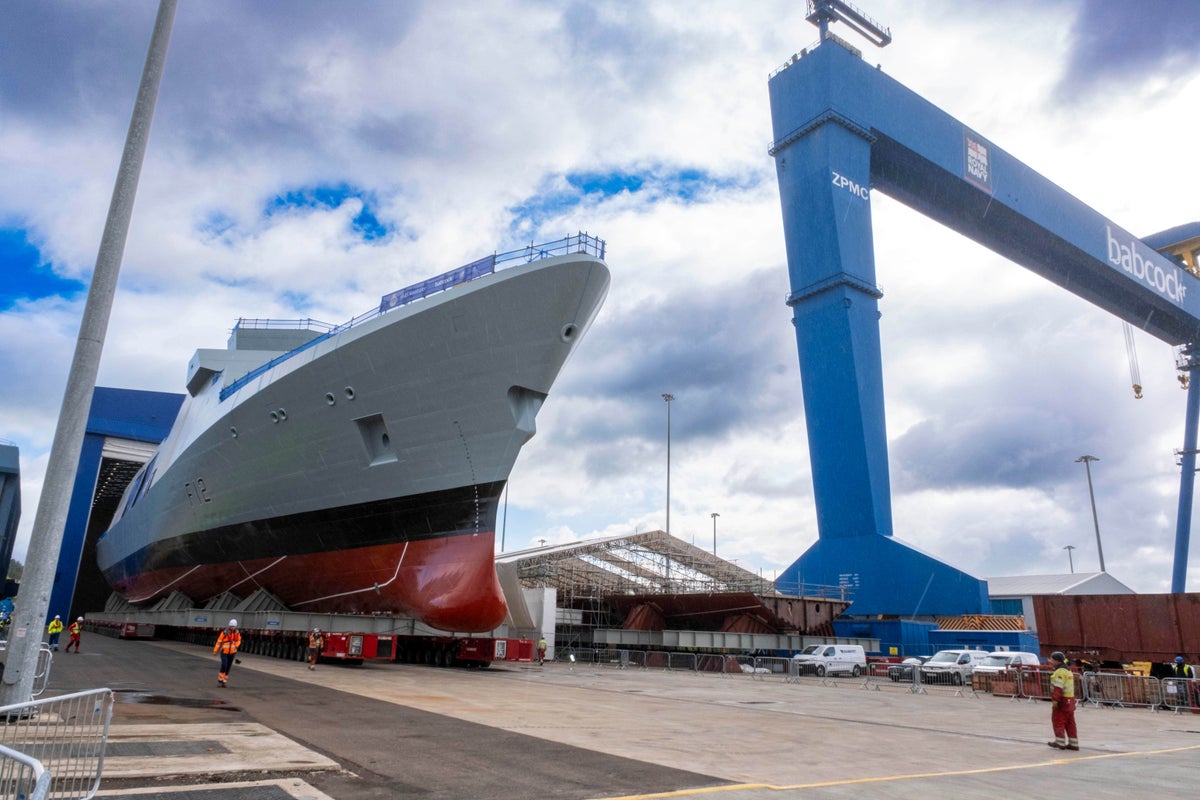 Royal Navy warship emerges from shipbuilding hall