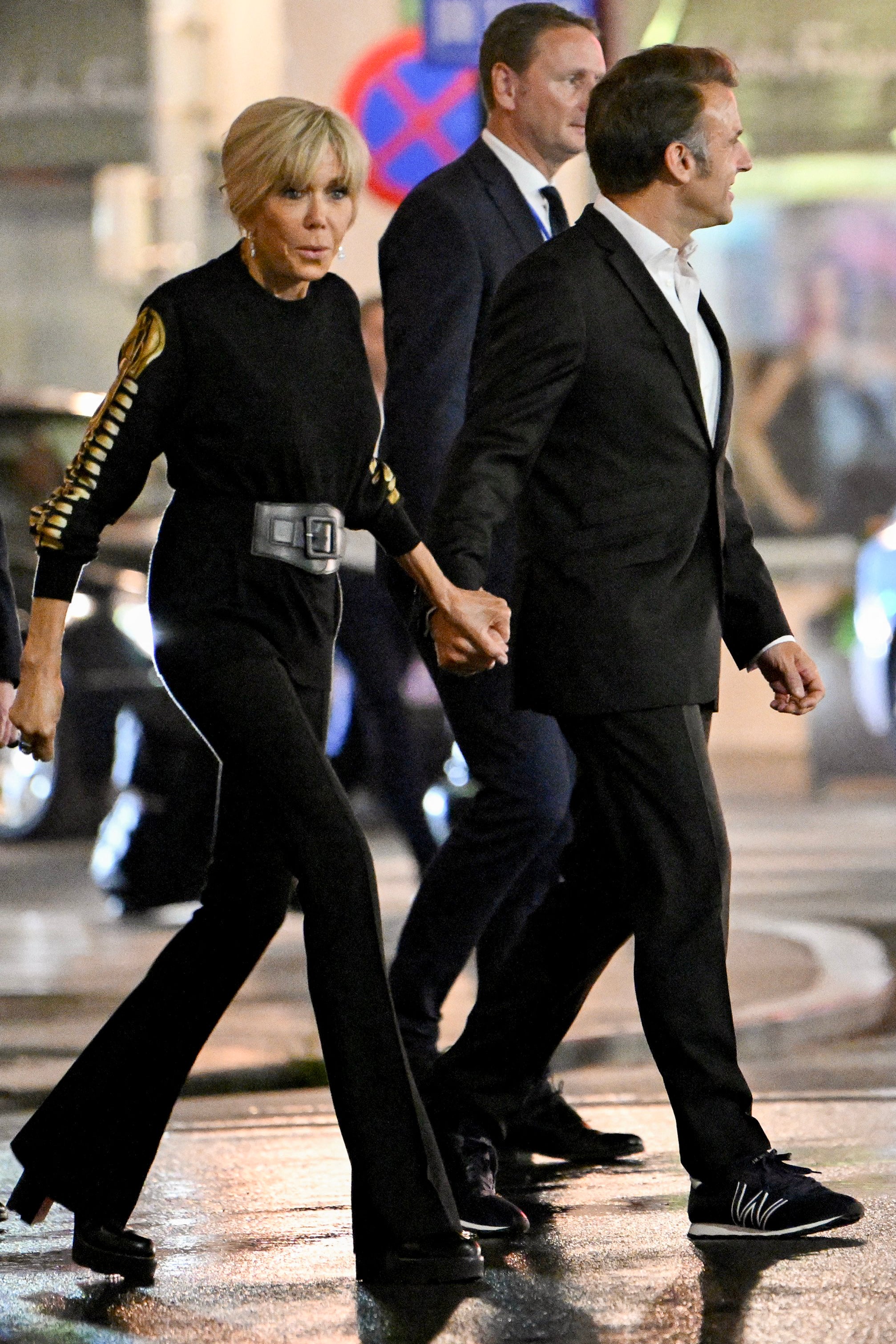 Emmanuel Macron and wife Brigitte all smiles and hand holding as they ...