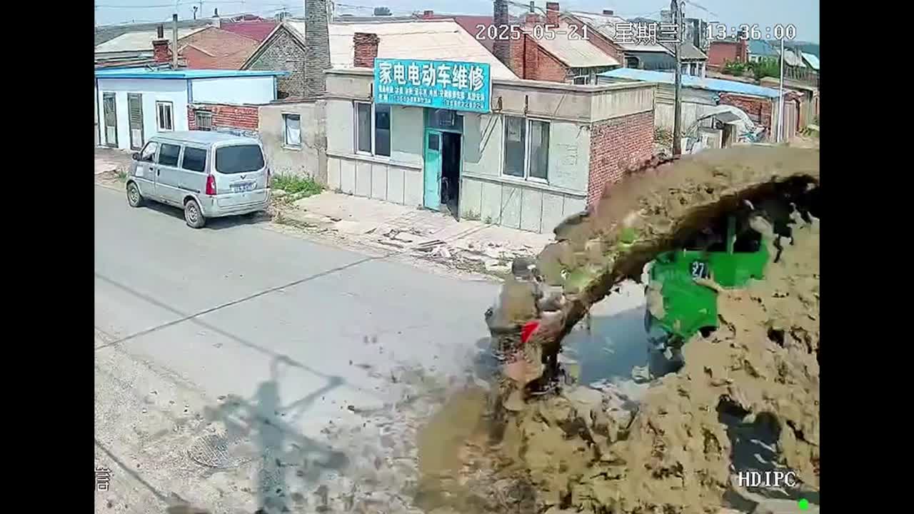 Elderly biker knocked over by flying cow manure after truck's sudden ...