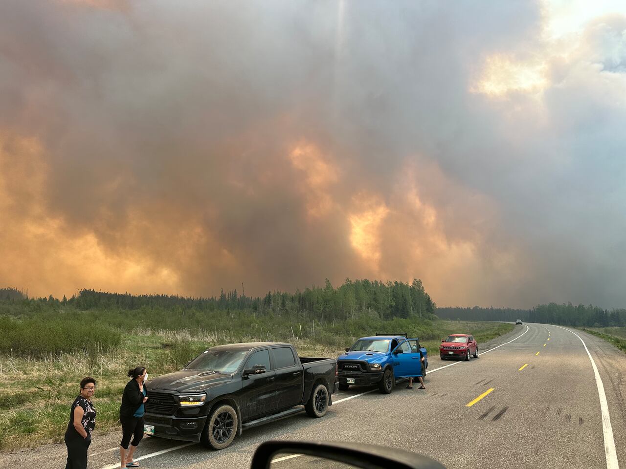 Improved weather helps crews battle wildfires in Manitoba's north, east ...
