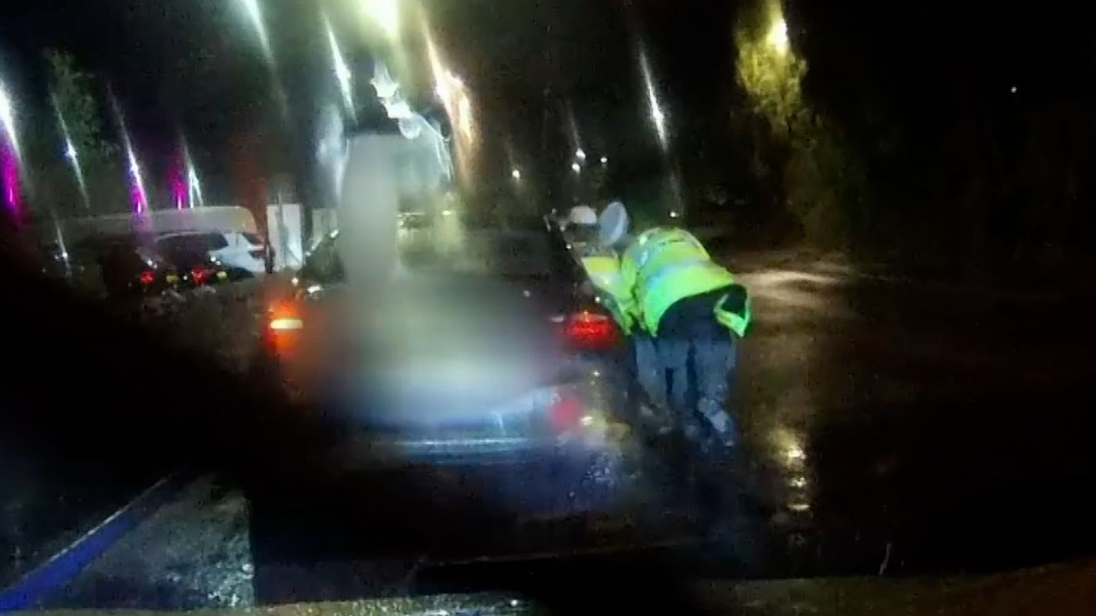 Woman drags police officers along the road