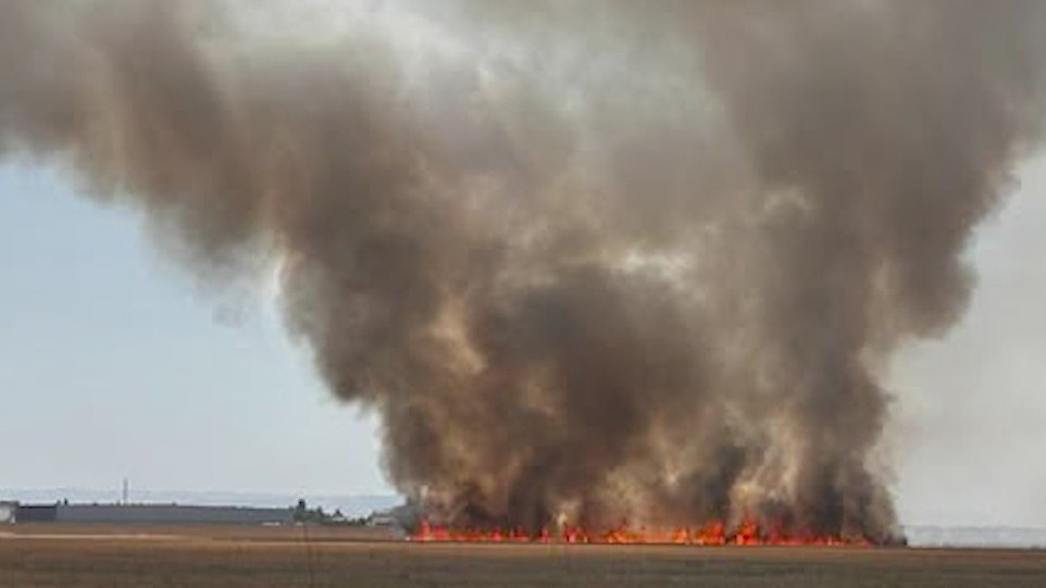 Big rig crash in Woodland causes wildfire