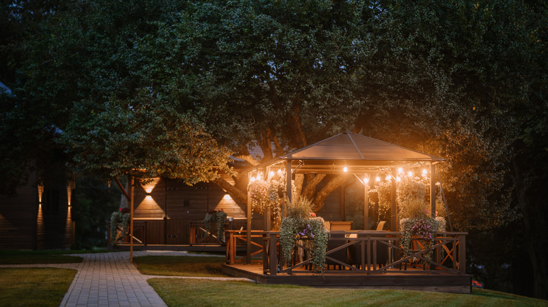 The Dollar Tree Broom Hack That Will Light Up Your Backyard For Summer