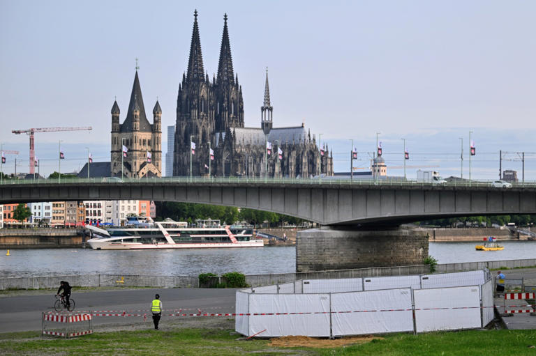 More than 20,000 people evacuated after three bombs are found near bridge