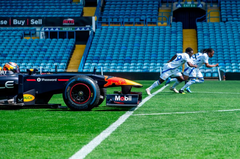 Premier League players race F1 car on pitch inside stadium as star ...