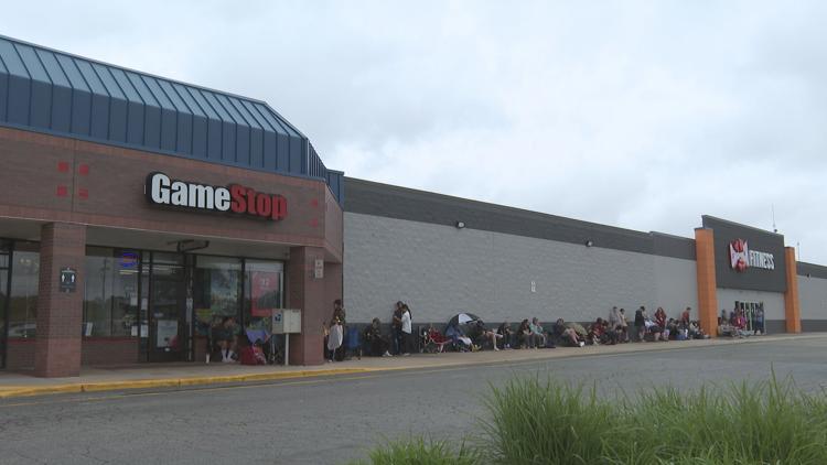 Gamers brave the rain to line up outside Walker GameStop for Nintendo ...