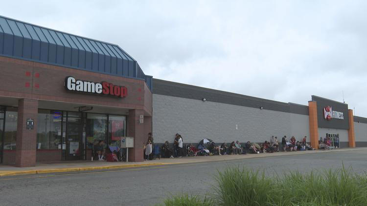 Eager gamers line up outside Walker GameStop for midnight release of ...