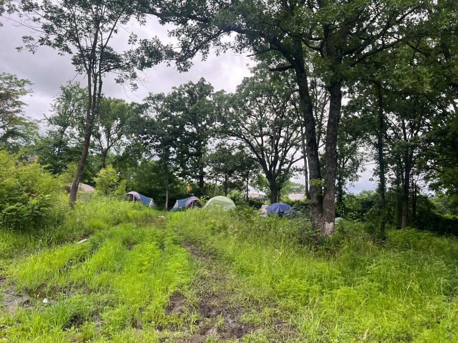 Protesters gather as ‘Safe Camp Initiative’ is heard at Fayetteville ...