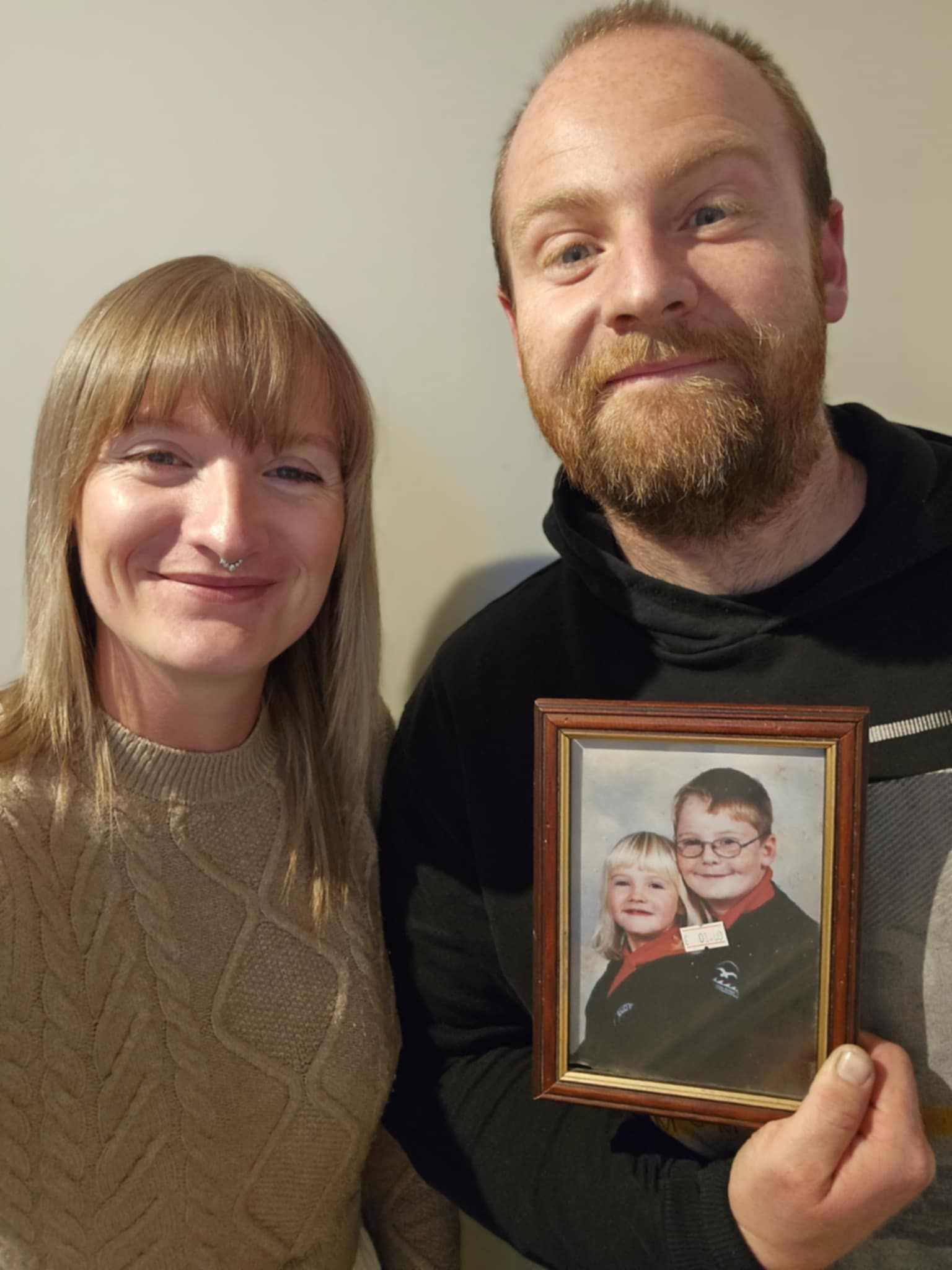Siblings reunited with school photo found in charity shop 300 miles away