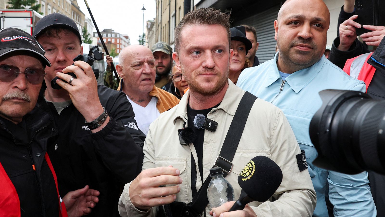 Tommy Robinson denies harassing two journalists