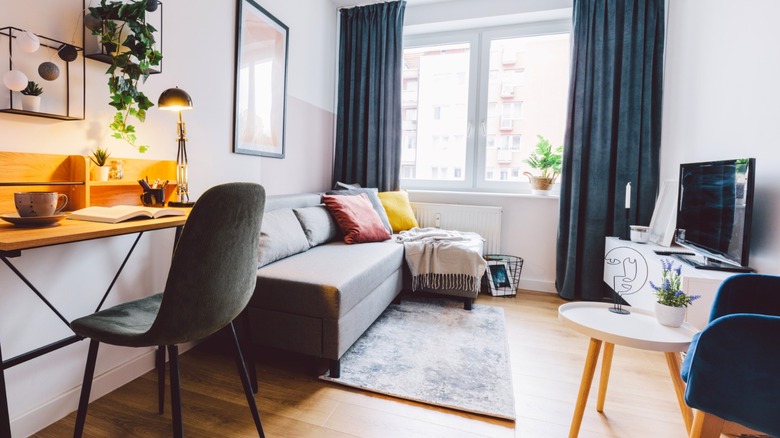 Couch Mistakes That Make A Small Living Room Feel Even More Cluttered