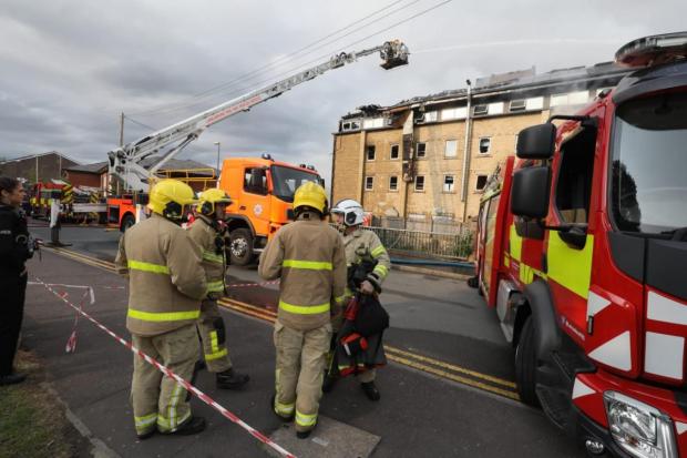 Fire crews still tackling fire pockets at derelict building blaze
