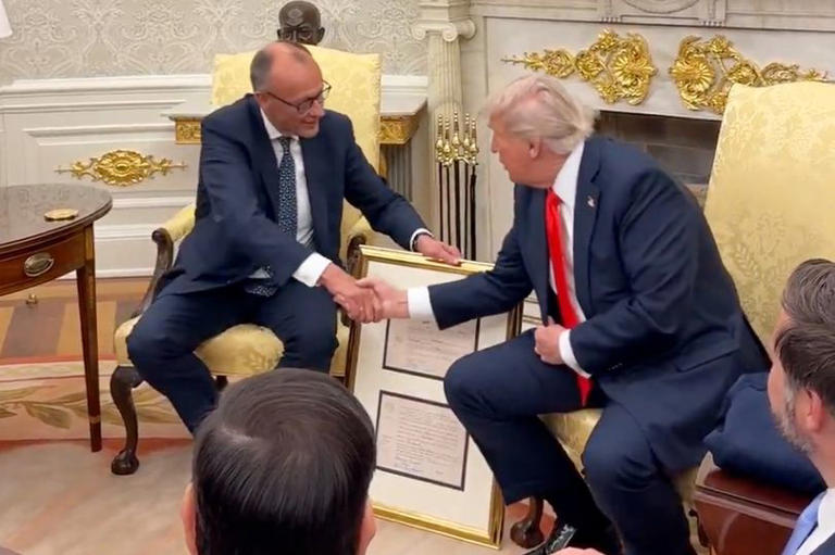 Donald Trump handed bizarre gift by German Chancellor as he's grilled ...