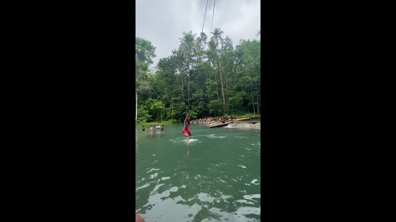 Rope swing over lagoon fails when tourist drags guide into water