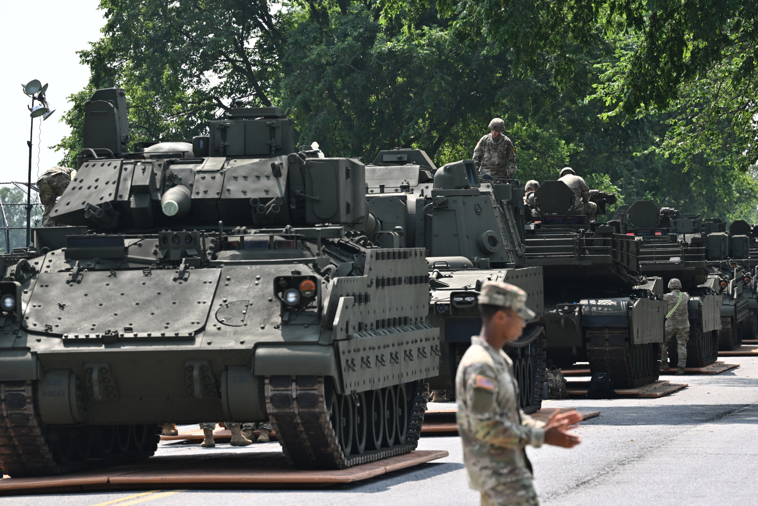Tanks roll through Washington DC for Trump's military parade: Photos