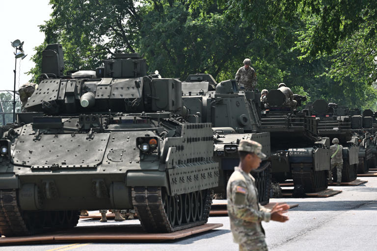 Tanks roll through Washington DC for Trump's military parade: Photos