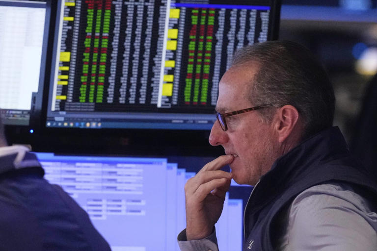 Nasdaq gains while Dow, S&P 500 fall as US inflation ticks higher