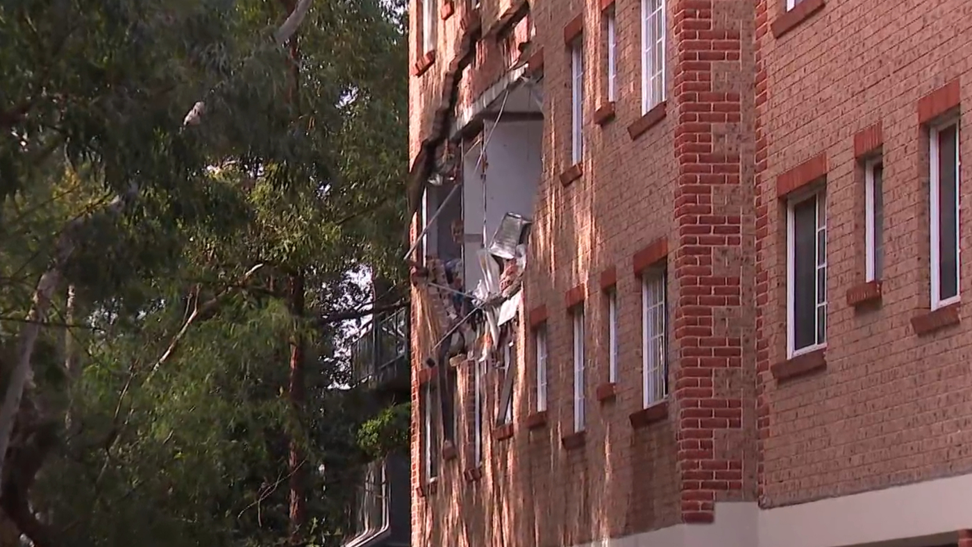One hospitalised after explosion blows wall apart in Sydney apartment block