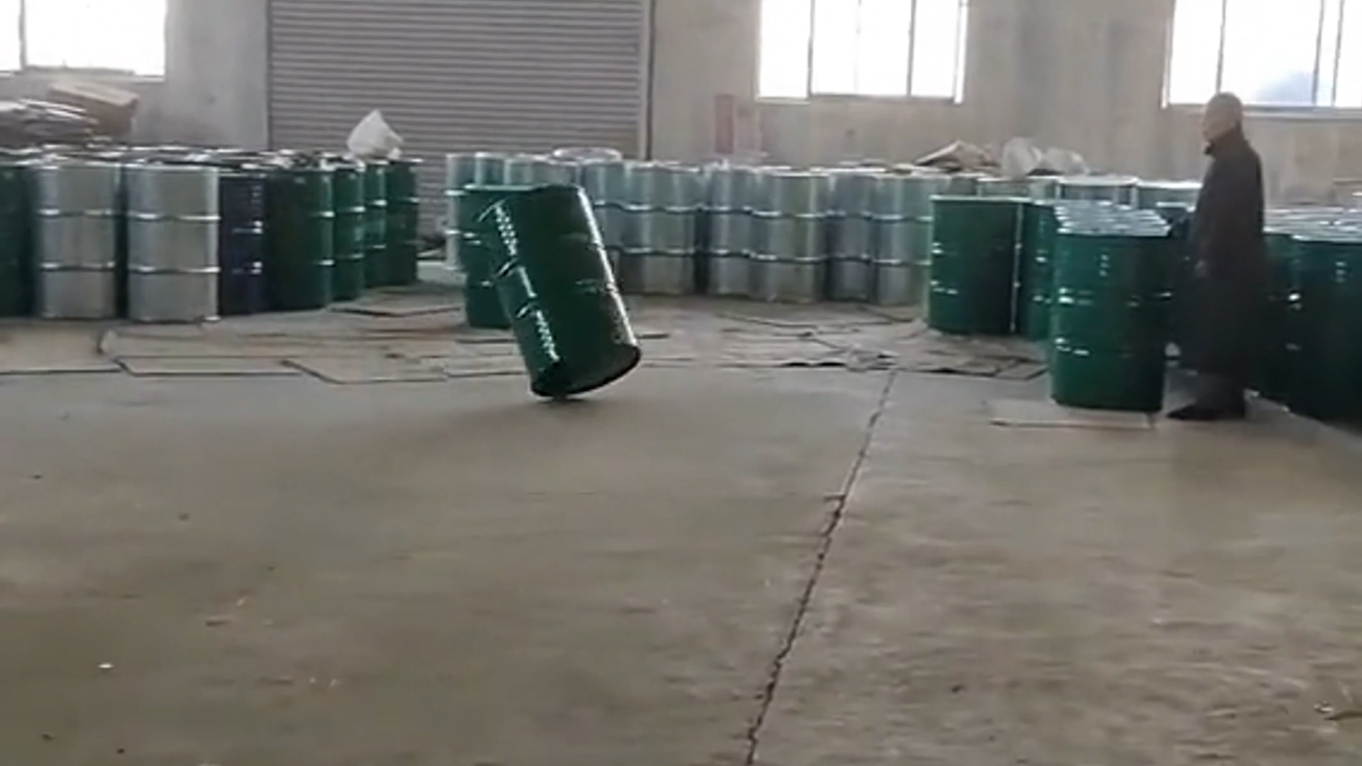 Man spins a 200-litre oil drums into perfect position using only his hands