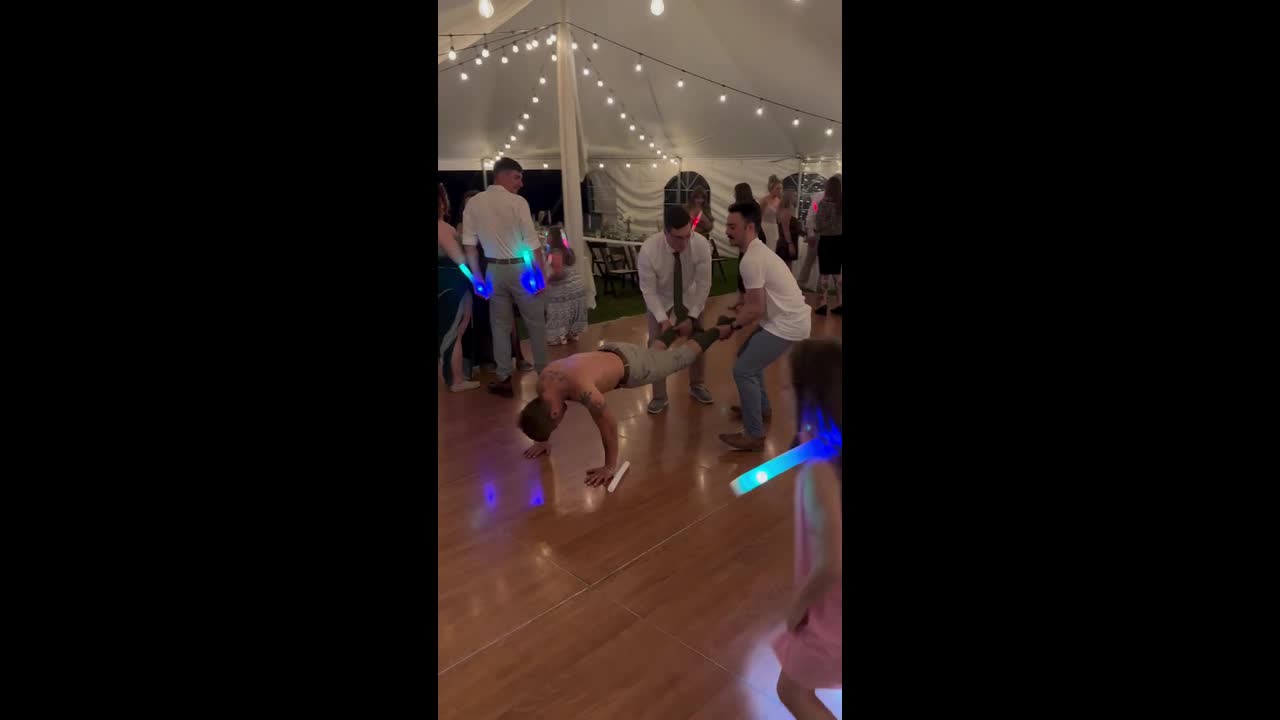 Best man attempts front flip, nails faceplant instead—Keeps dancing anyway