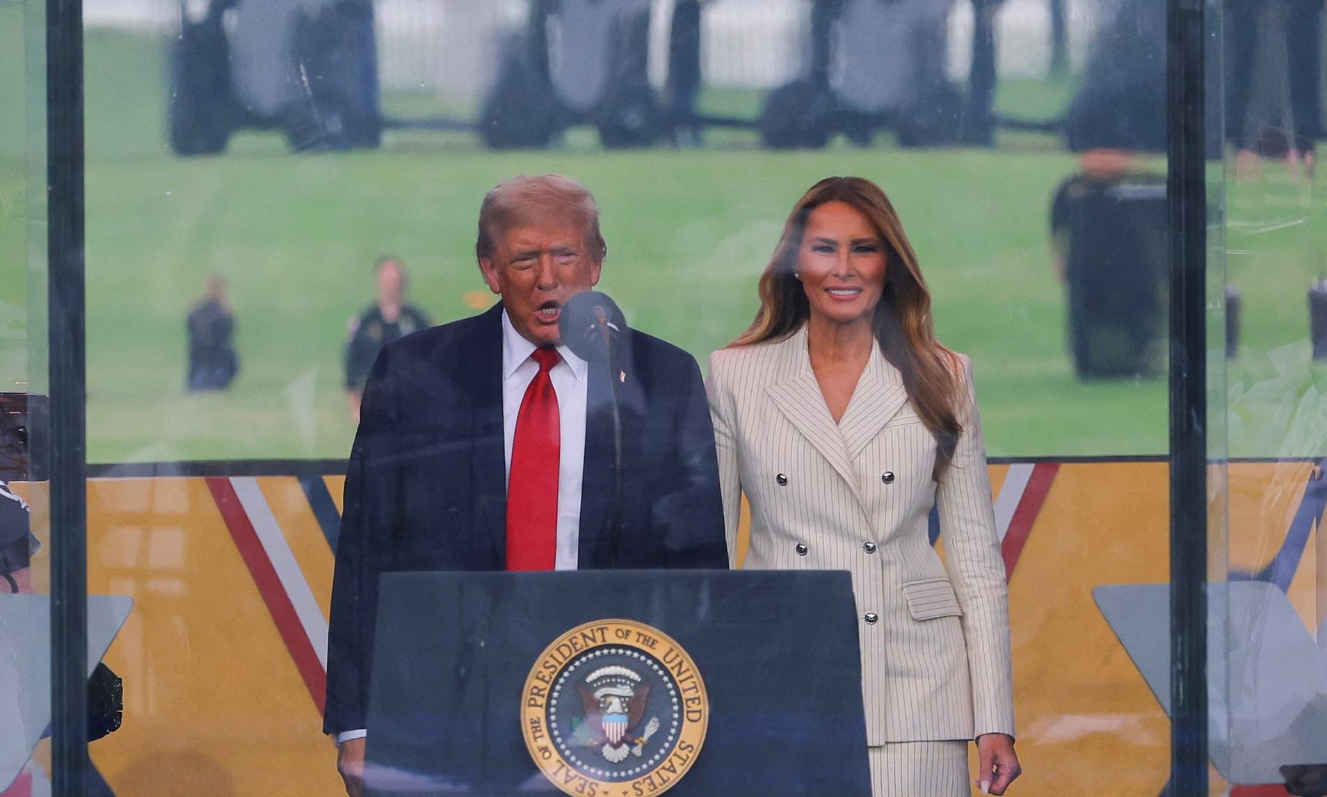 Donald Trump and Melania arrive at military parade as crowd sings ...