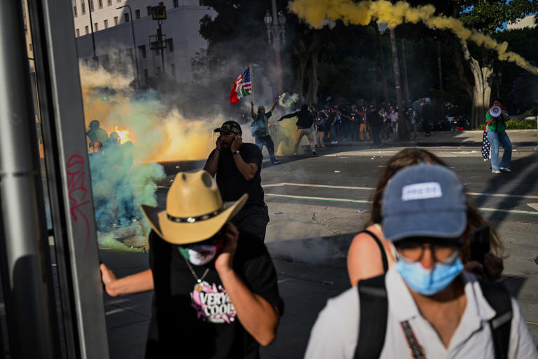 Police deploy stun grenades, rubber bullets, tear gas on L.A. protesters
