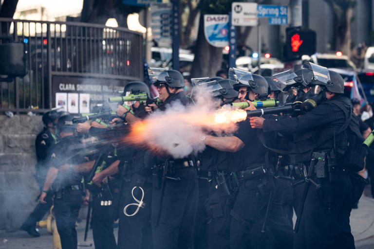 Police deploy stun grenades, rubber bullets, tear gas on L.A. protesters