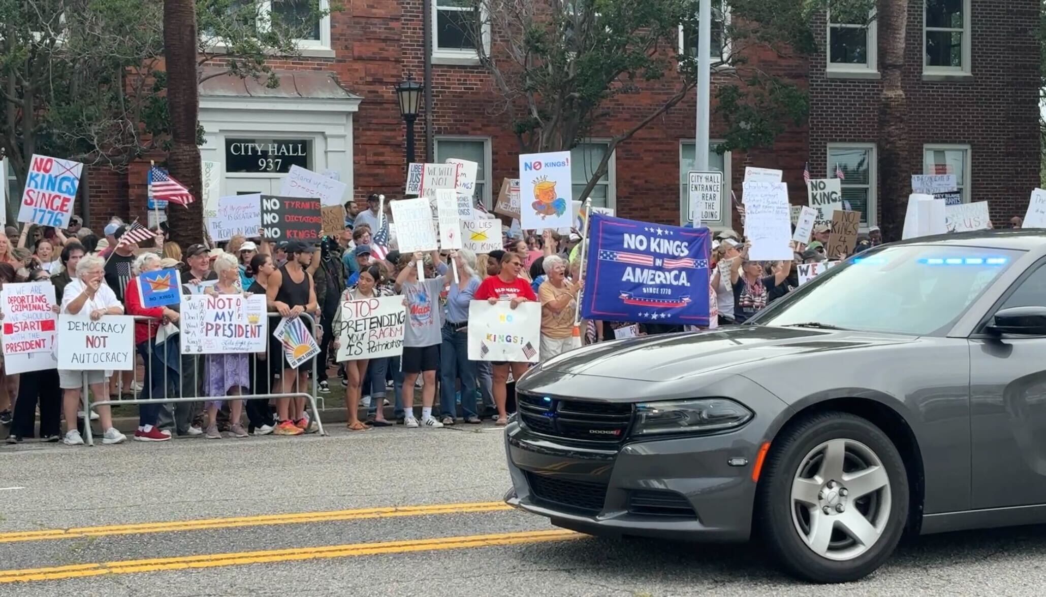 Protesters and counter-protesters speak during ‘No Kings’ protests in ...