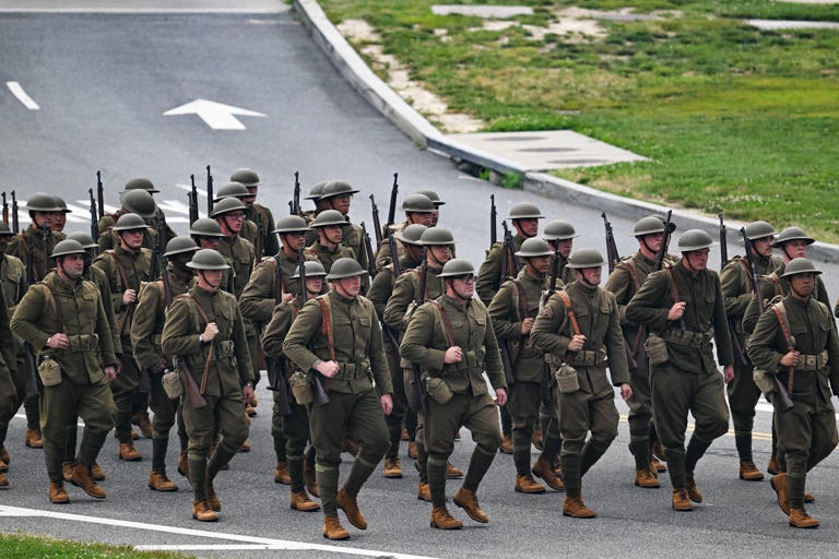 Trump's birthday military parade in pictures: Soldiers march and tanks ...