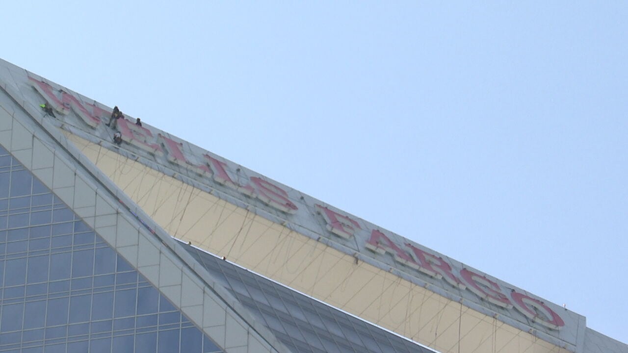 Wells Fargo installs sign on one of tallest Uptown buildings