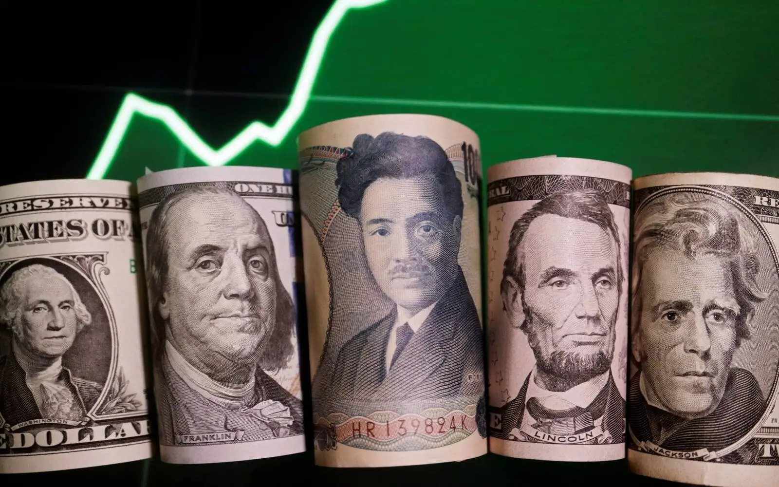 Dollar steady, yen under pressure ahead of Japan election