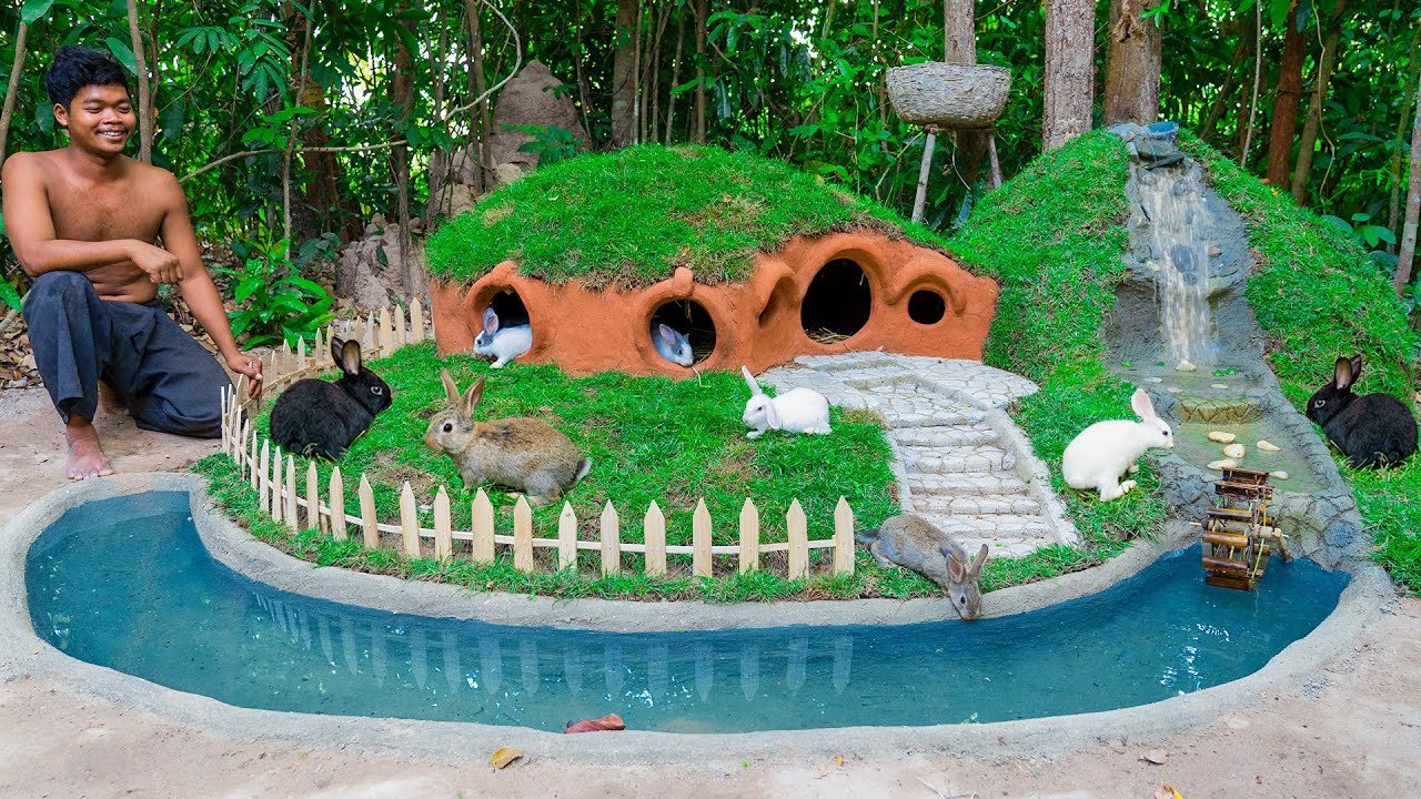 Clay, stone, and bamboo shaped into a hobbit house with a turtle pond ...
