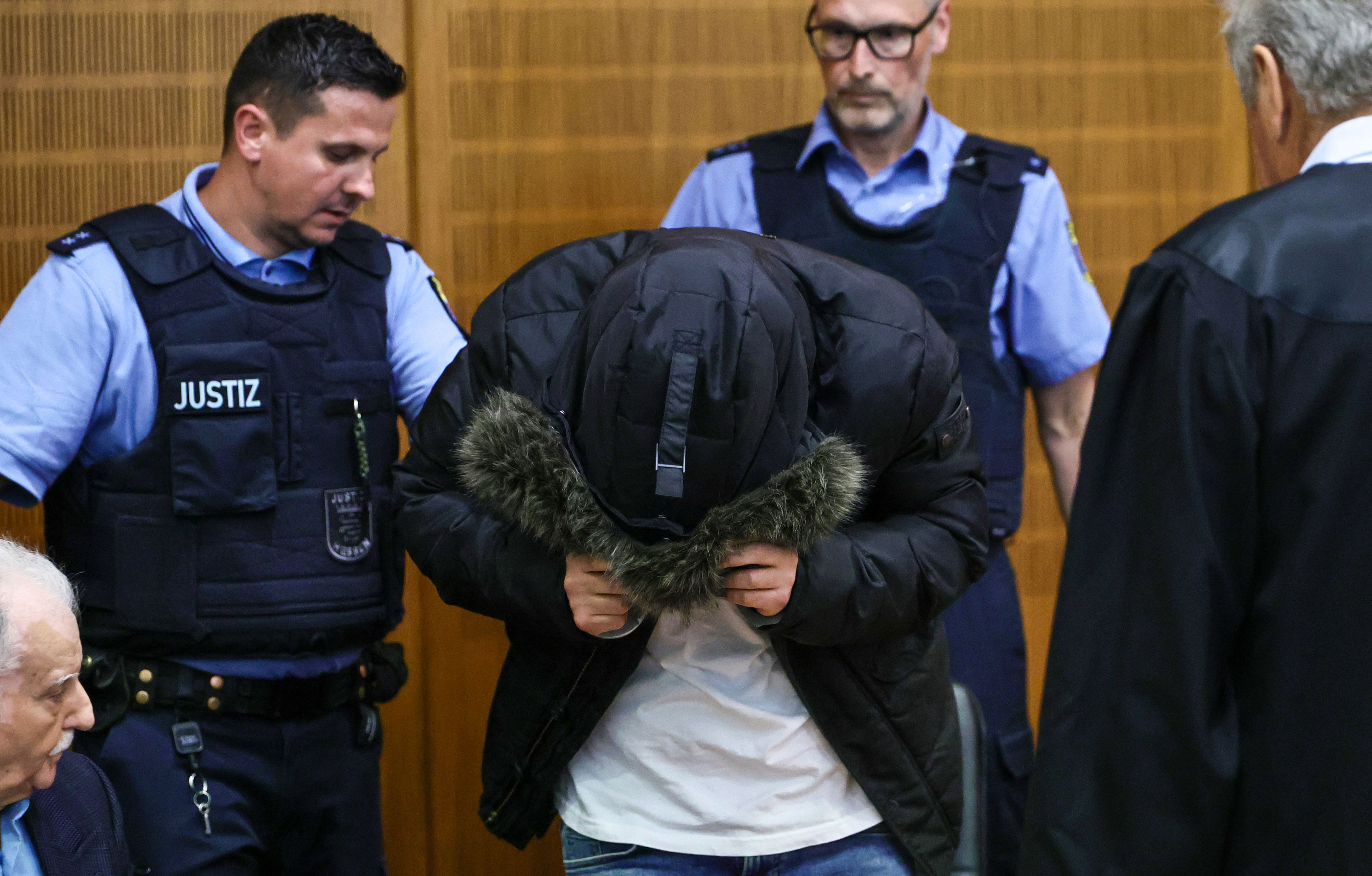 Syrian doctor gets life sentence in Germany for slayings, torture under ...
