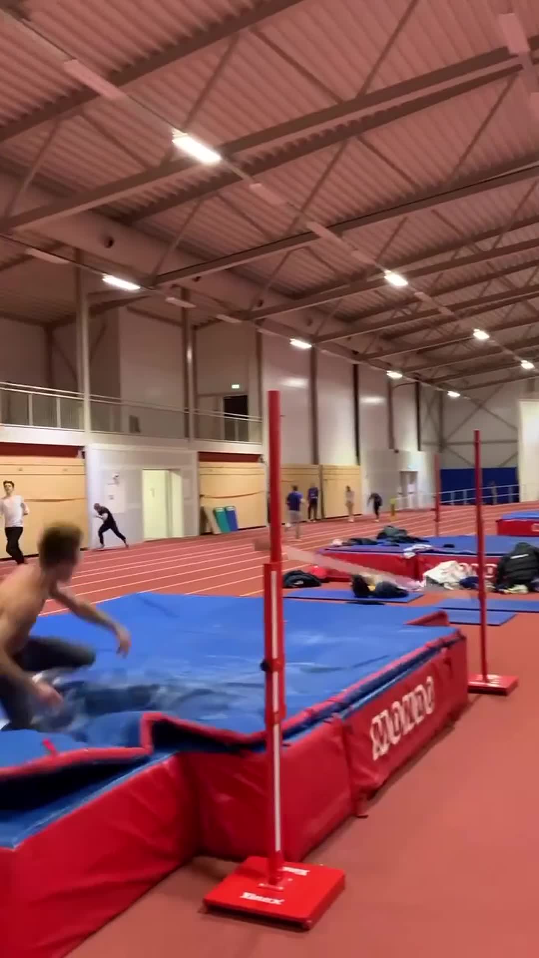 High Jump Training Session in Indoor Track Facility