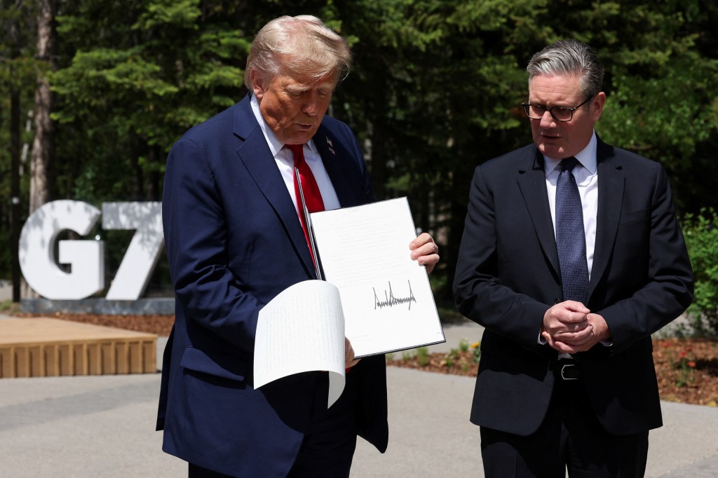 Trump drops copy of newly signed UK trade deal as PM Keir Starmer ...