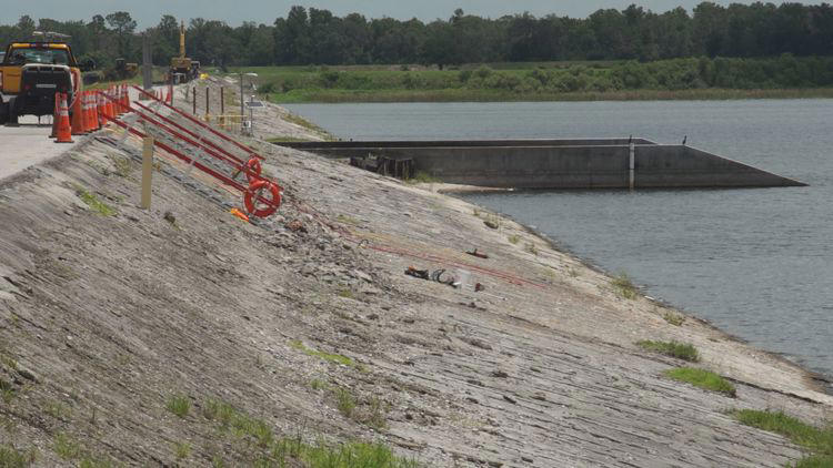 Crews work to repair surface cracks, deterioration at Lake Manatee Dam
