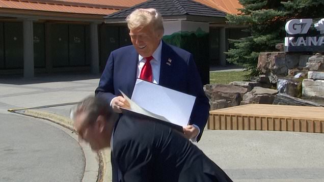 Trump drops papers of US-UK trade deal all over the floor at G7 Summit ...