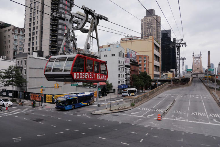 Mysterious hooded figure scales 250-foot-high Roosevelt Island Tram ...