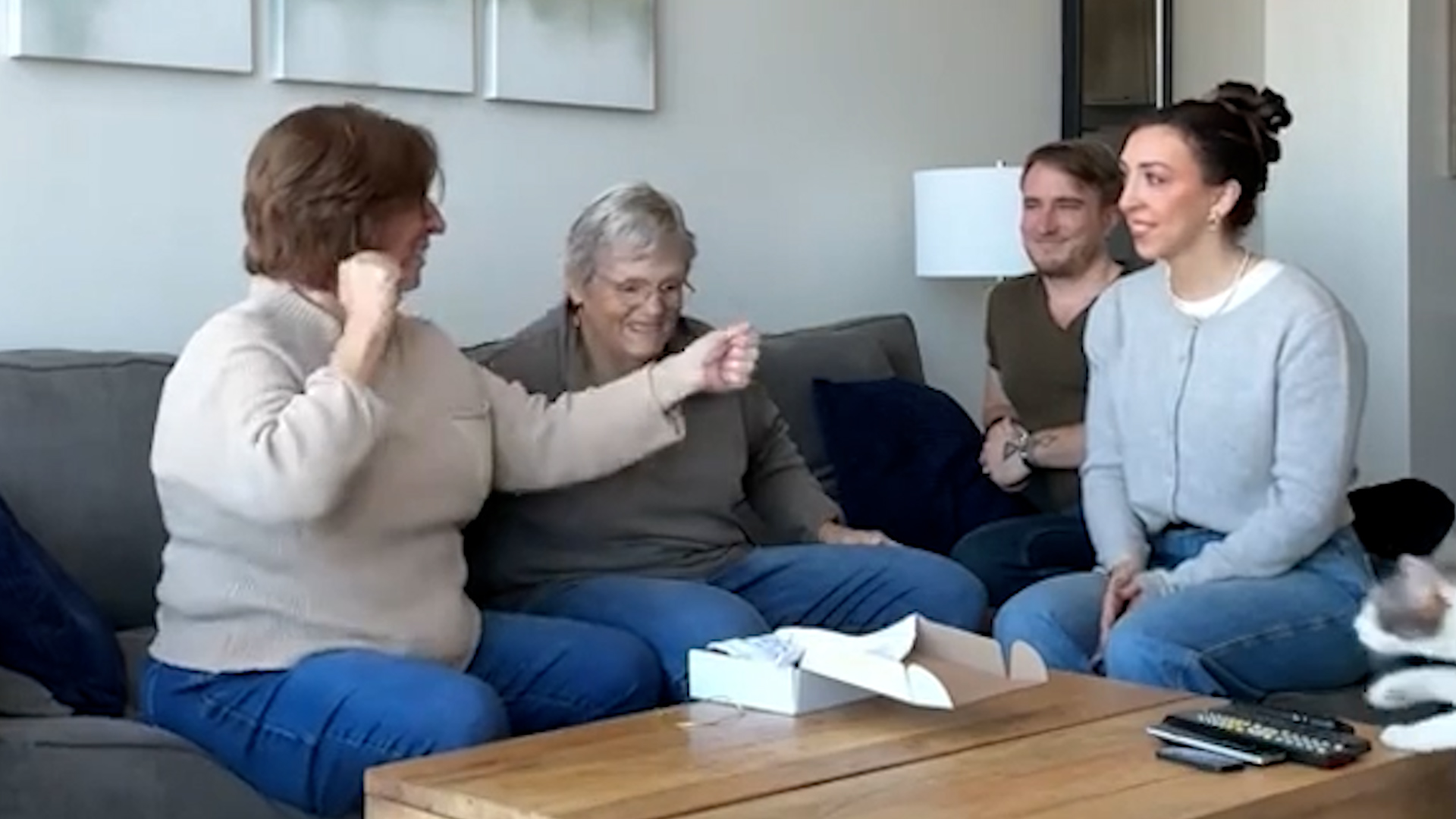 Daughter surprises her two mums with pregnancy reveal during Pride Month