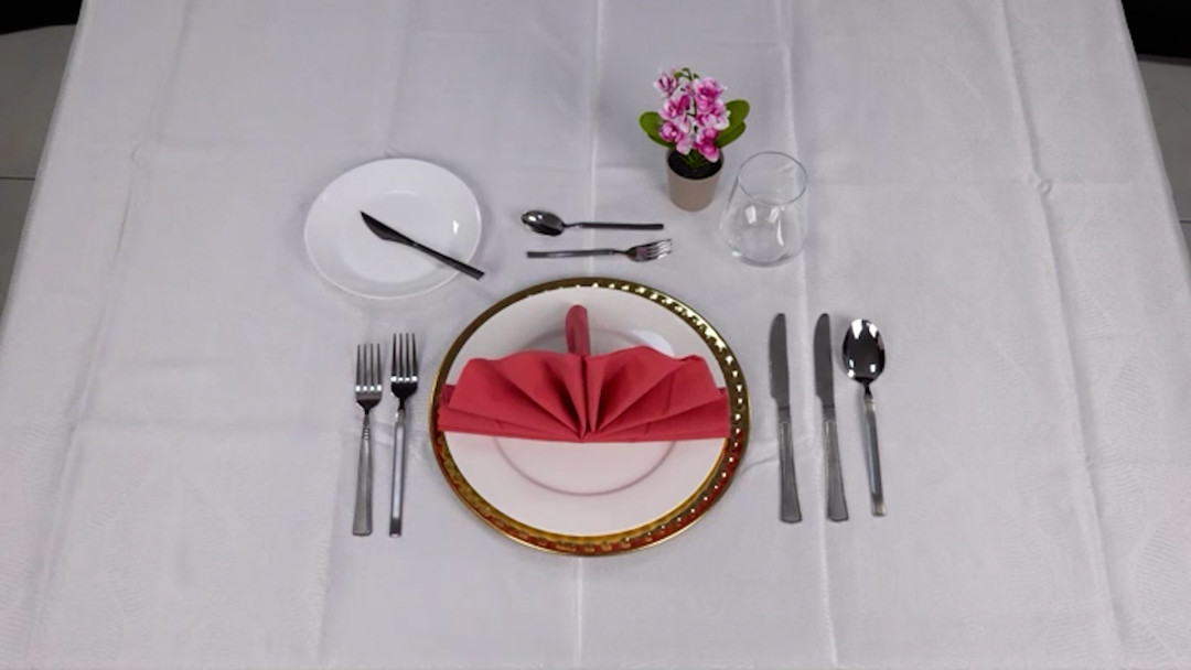 Master Setting a Formal Dinner Table