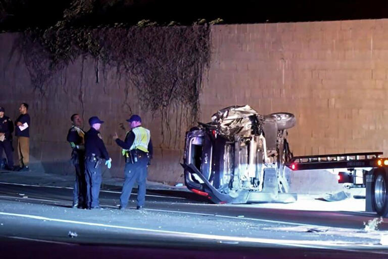 Off-duty sheriff's deputy and companion step out of car on to freeway ...